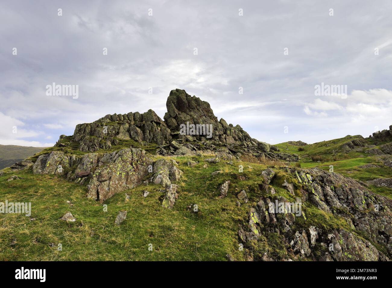 The summit of Helm Crag fell, above Grasmere in the Central Fells, Lake ...