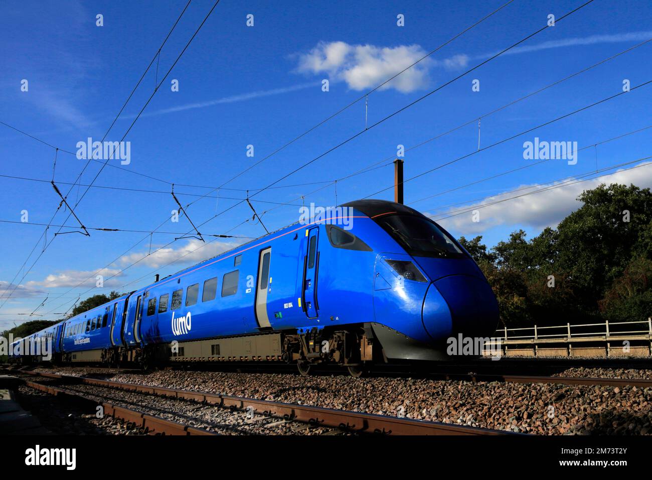 Lumo trains 803004 train, East Coast Main Line near Grantham town ...