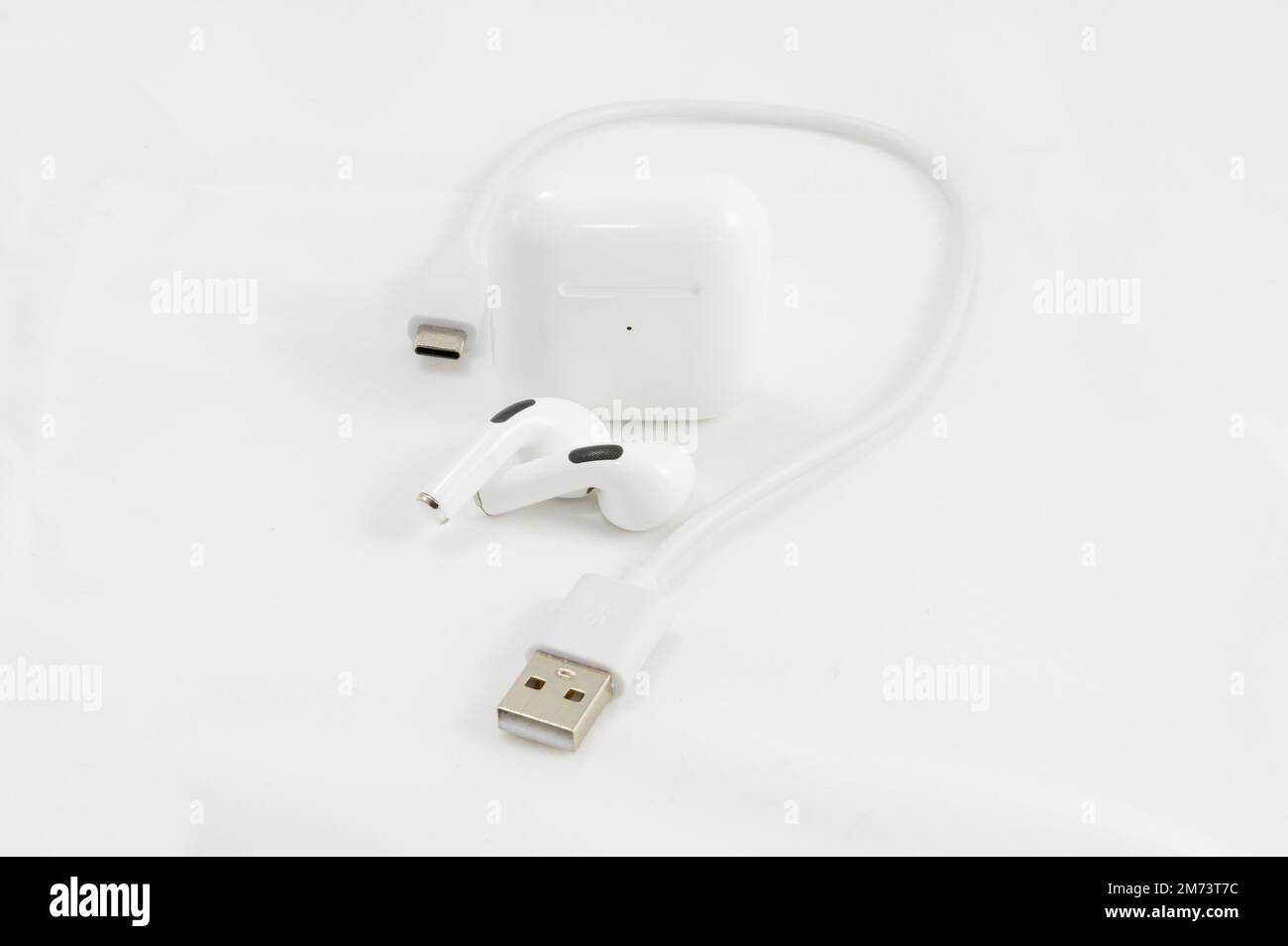 White wireless headphones on white background. Pair of Earbuds Stock ...