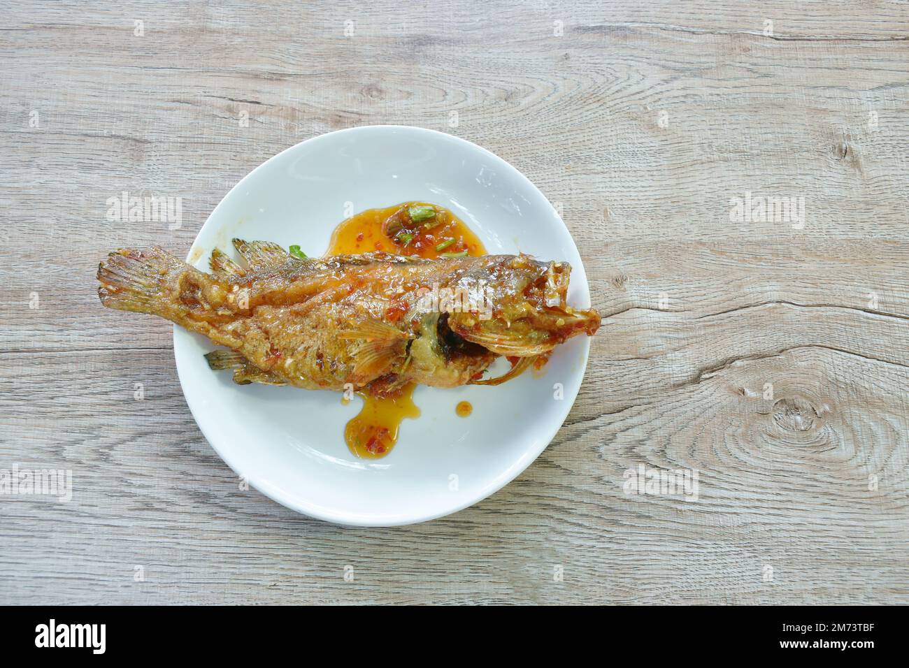 batter fried red grouper fish dressing sweet and spicy chili sauce on ...