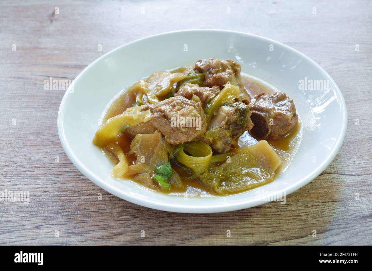 boiled pork bone with pickled cabbage stew on plate Stock Photo - Alamy