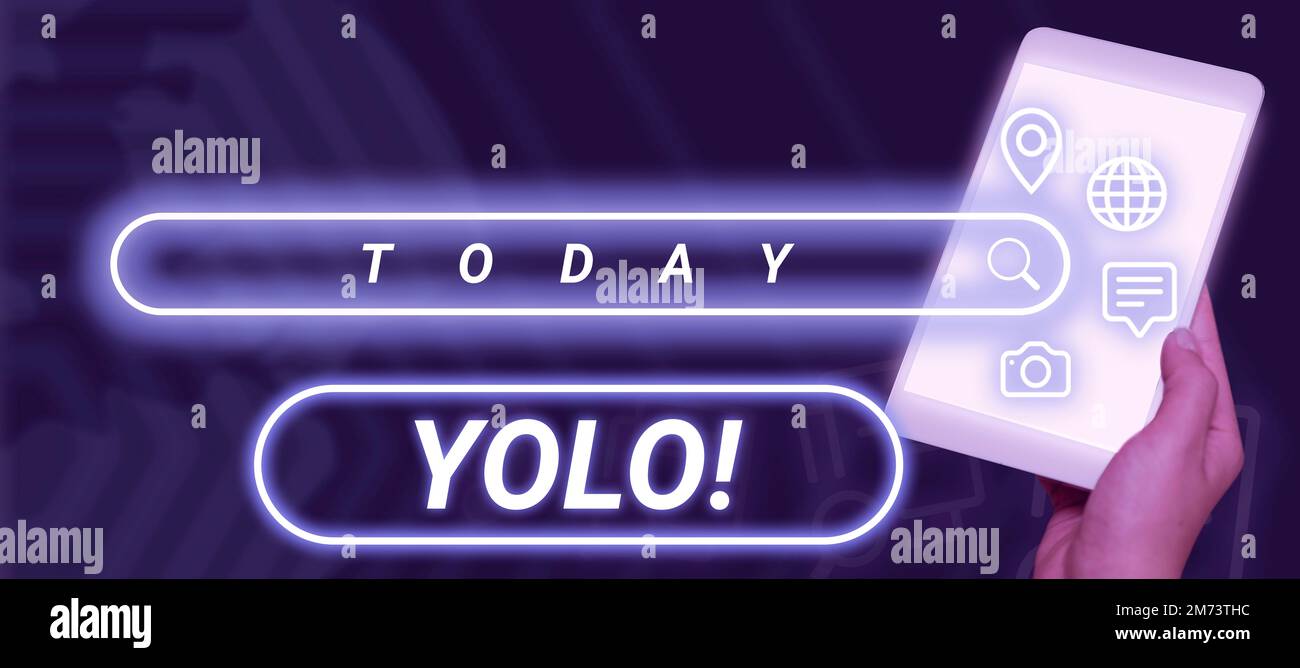 Sign displaying Yolo. Word Written on stand for You only live once popular phase among students ...