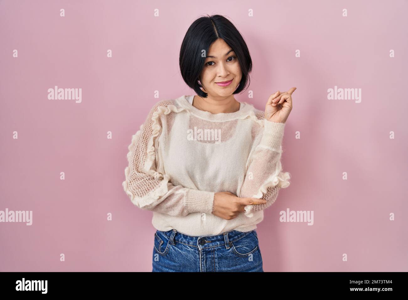 Young asian woman standing over pink background with a big smile on ...