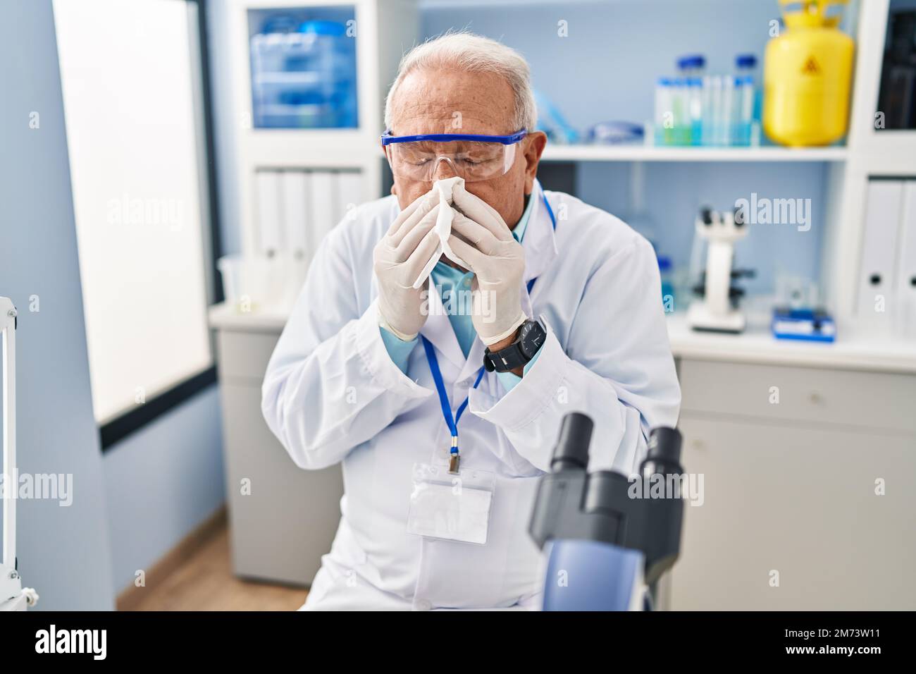 Sick man using handkerchief hi-res stock photography and images - Alamy