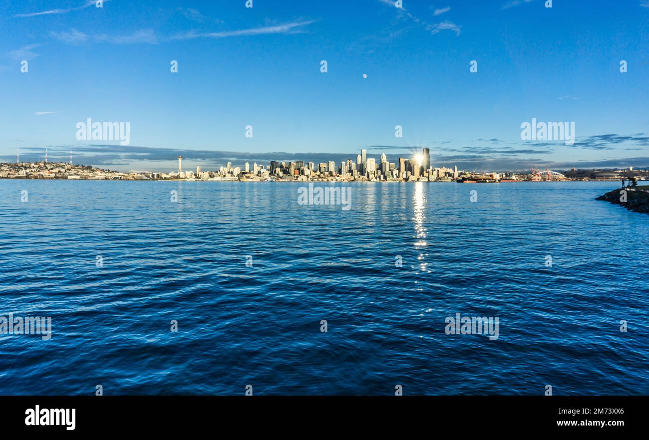 The sun reflects from buildings in the skyline of Seattle, Washington ...
