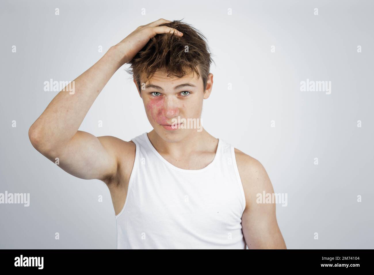 A portrait of a 17 year old teenage boy wearing a white tank top Stock ...