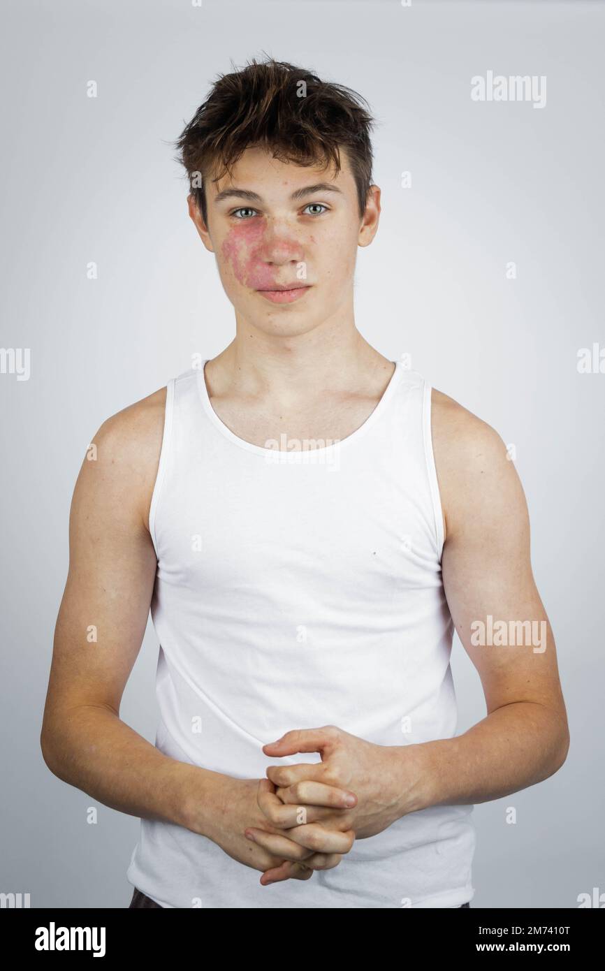 A portrait of a 17 year old teenage boy wearing a white tank top Stock ...