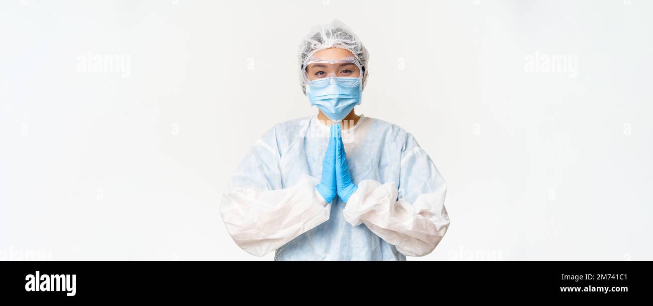 Please vaccinate. Smiling asian female doctor or nurse in personal ...