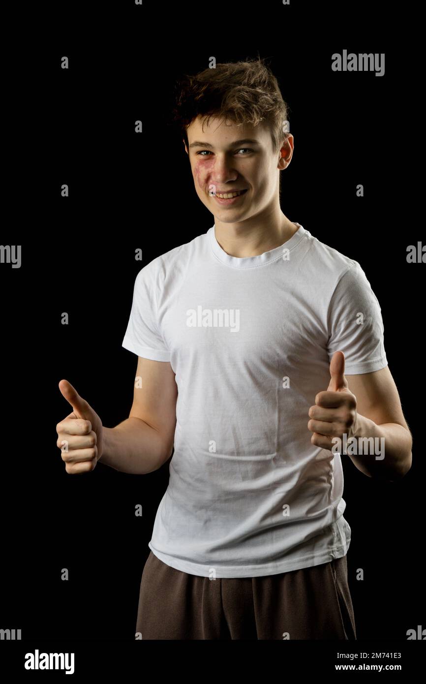 Portrait of a happy 17 year old boy against a black background Stock ...
