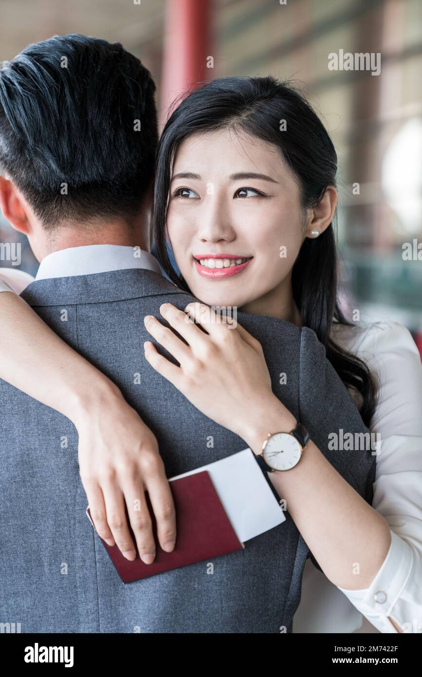 Two friends hug airport hi-res stock photography and images - Alamy