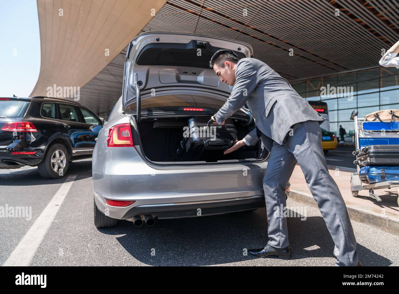 Business man to get off Stock Photo - Alamy