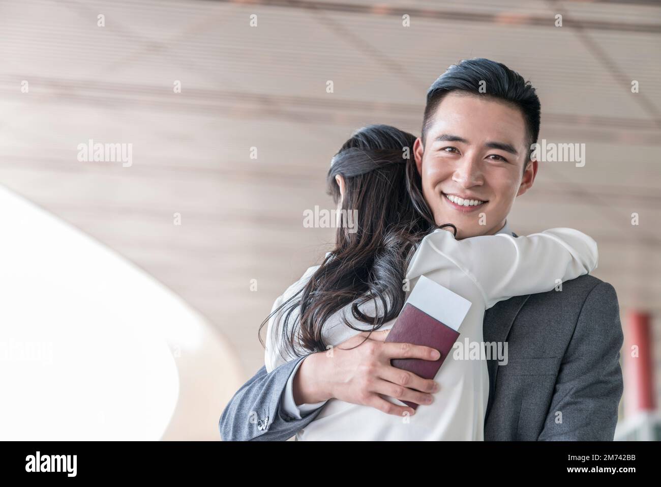 Two friends hug airport hi-res stock photography and images - Alamy