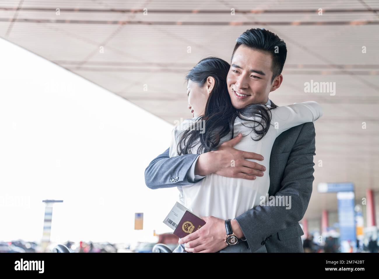 Two friends hug airport hi-res stock photography and images - Alamy