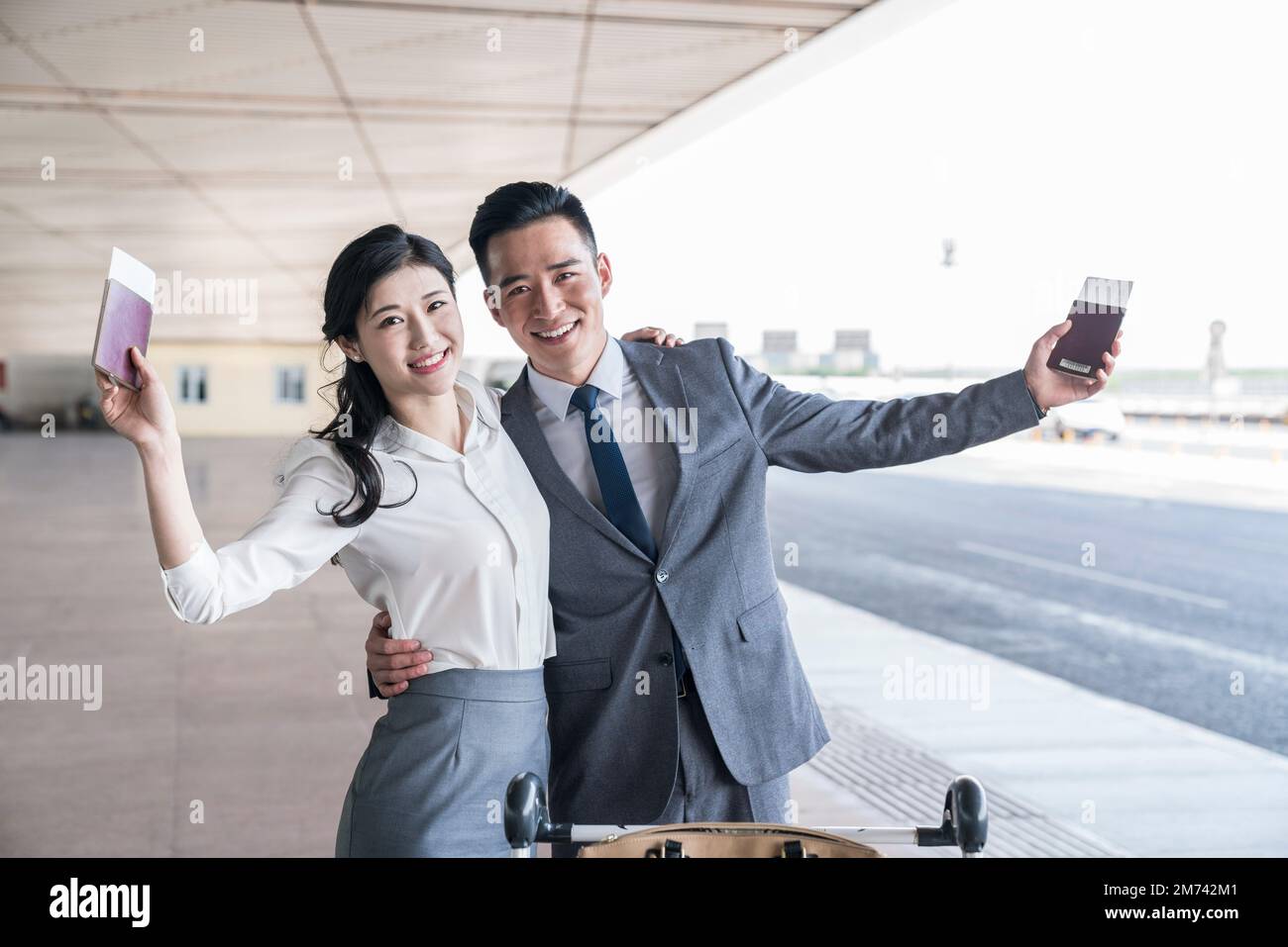Young lovers together hug at the airport Stock Photo - Alamy