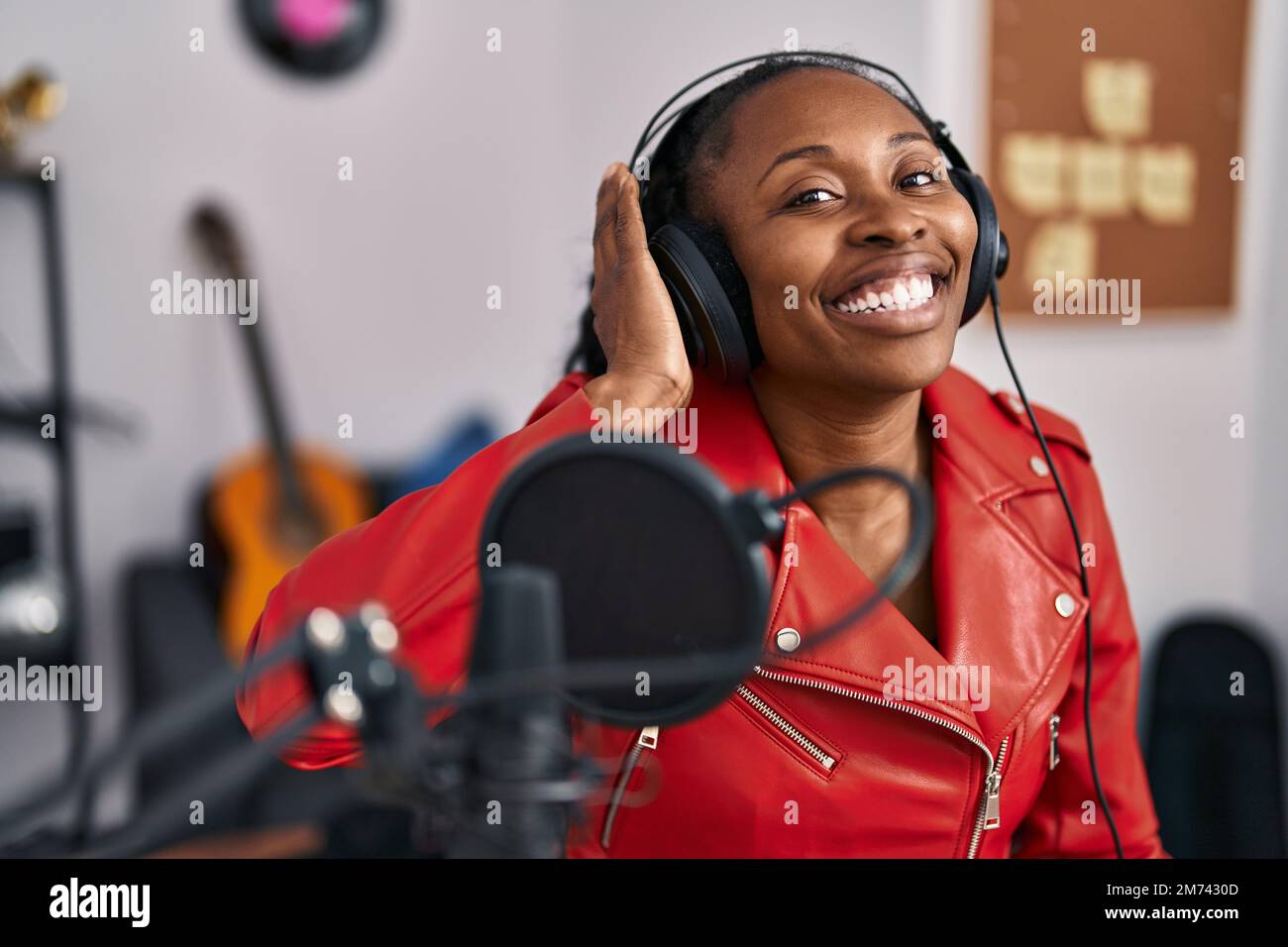 African american woman musician singing song at music studio Stock ...
