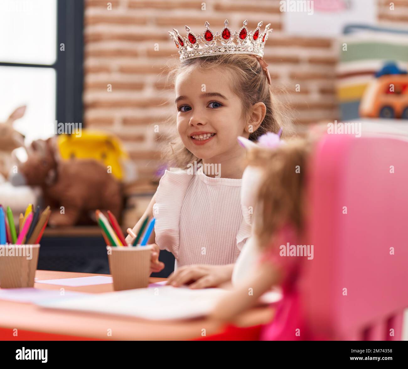 Adorable caucasian girl smiling confident wearing queen crown at ...
