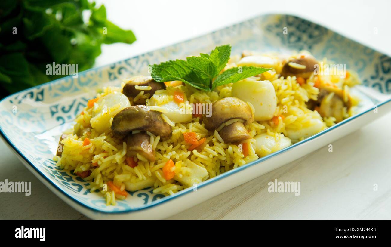 Fried rice with curry, vegetables and cuttlefish Stock Photo - Alamy