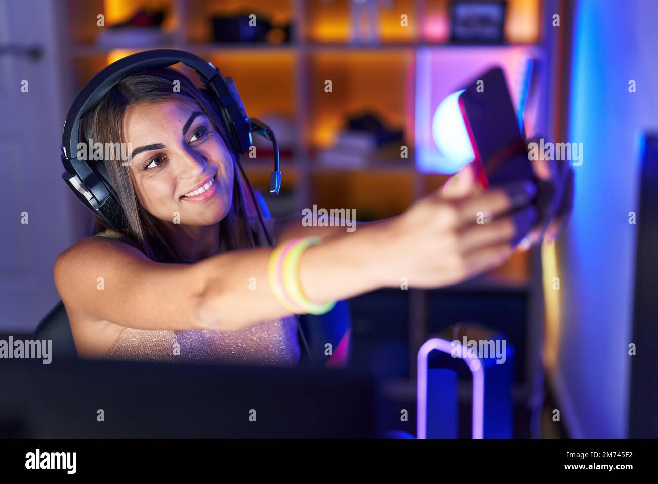 Young beautiful hispanic woman streamer smiling confident make selfie ...