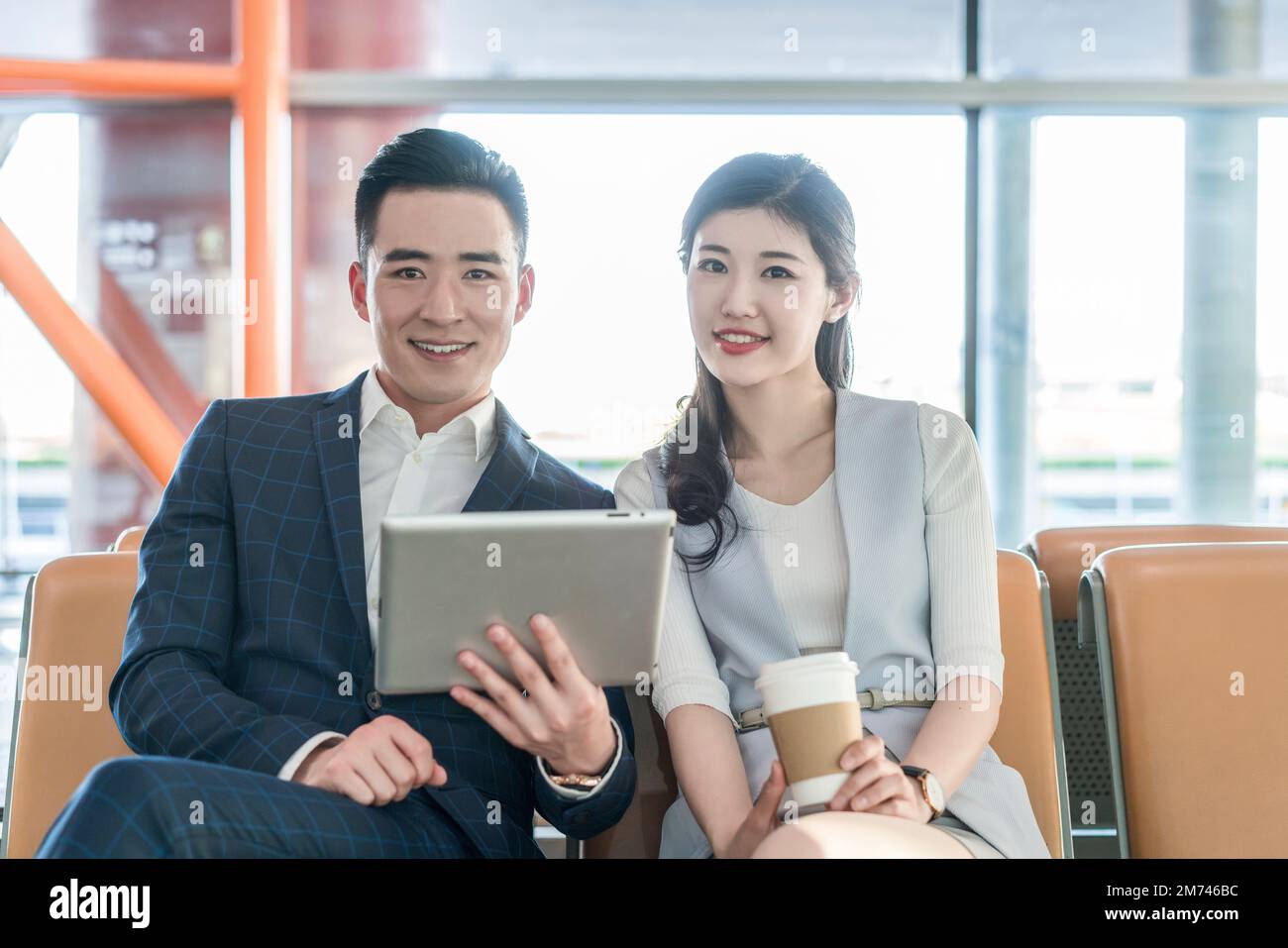 Young business people in the airport lounge Stock Photo - Alamy