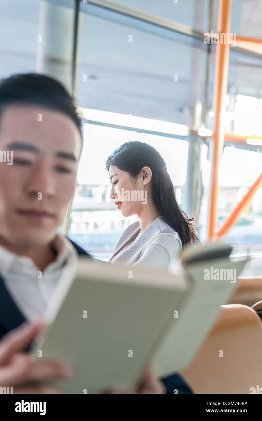 Young business people in the airport lounge Stock Photo - Alamy