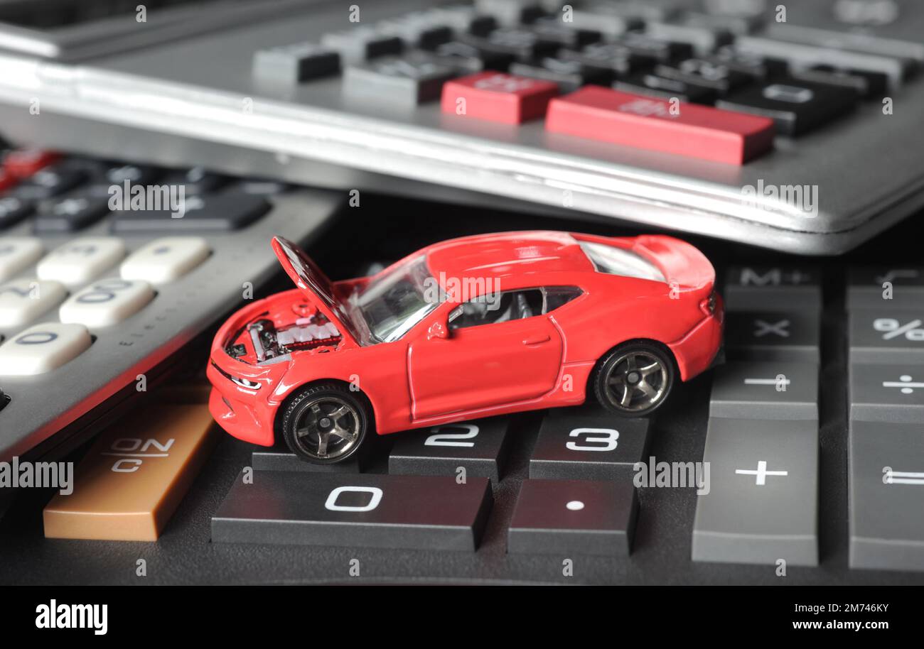 MODEL SALOON CAR WITH RAISED BONNET AND CALCULATORS RE CAR REPAIRS ...