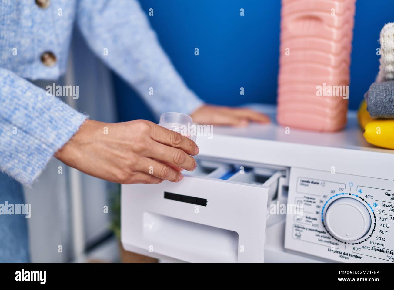 Woman pouring fabric softener washing hi-res stock photography and ...