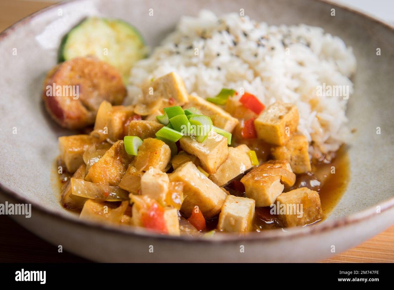 Dish with fried tofu, rice and vegetables Stock Photo - Alamy