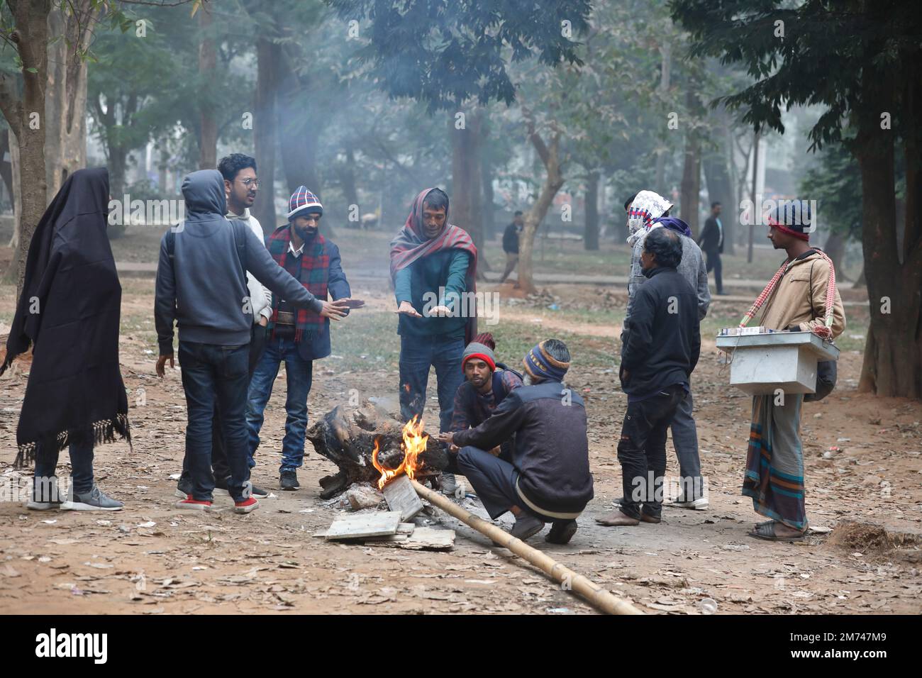 Dhaka, Bangladesh - January 07, 2023: People are burning fire at ...