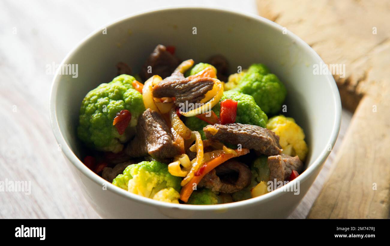 Dish with beef and vegetables like carrot and green broccoli Stock ...