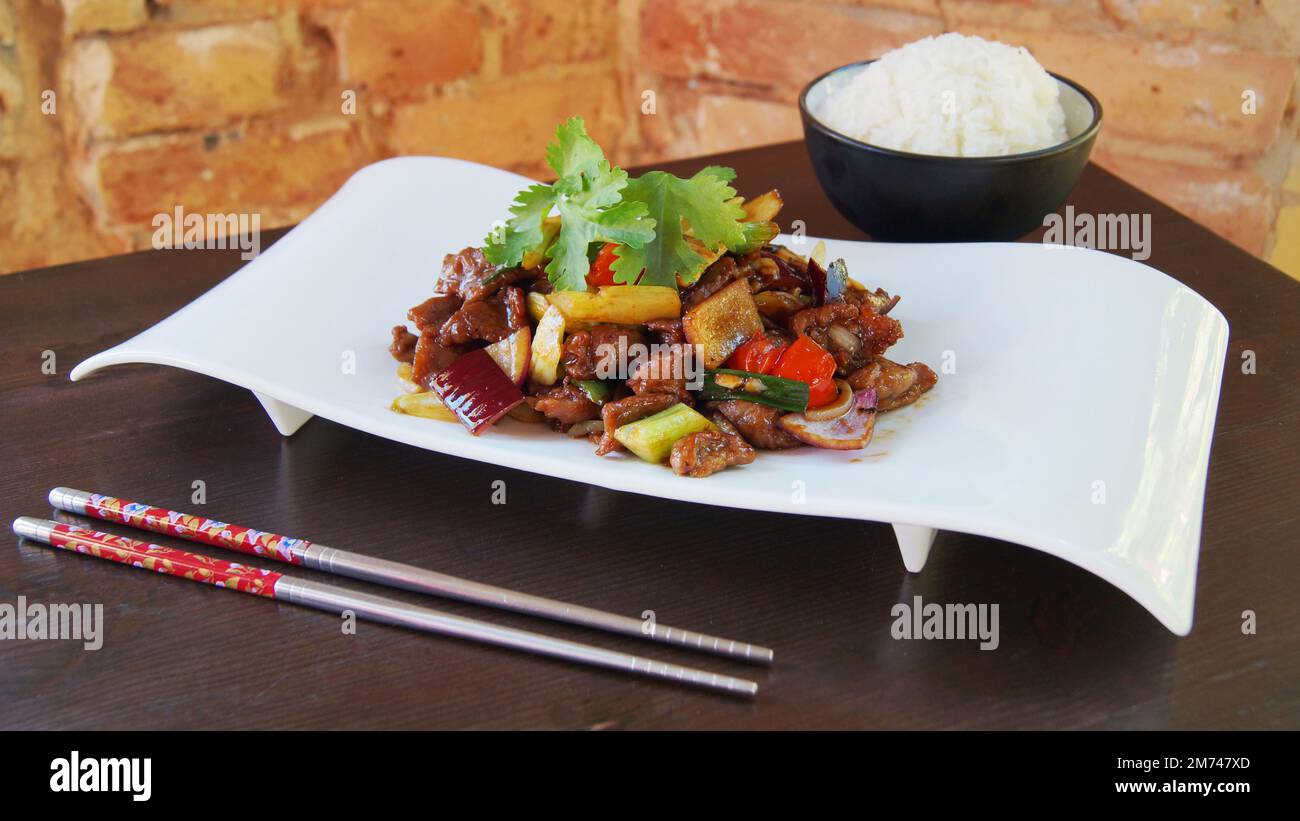 Dish with fried pork in a restaurant in Tokyo. Asian combo plate with ...