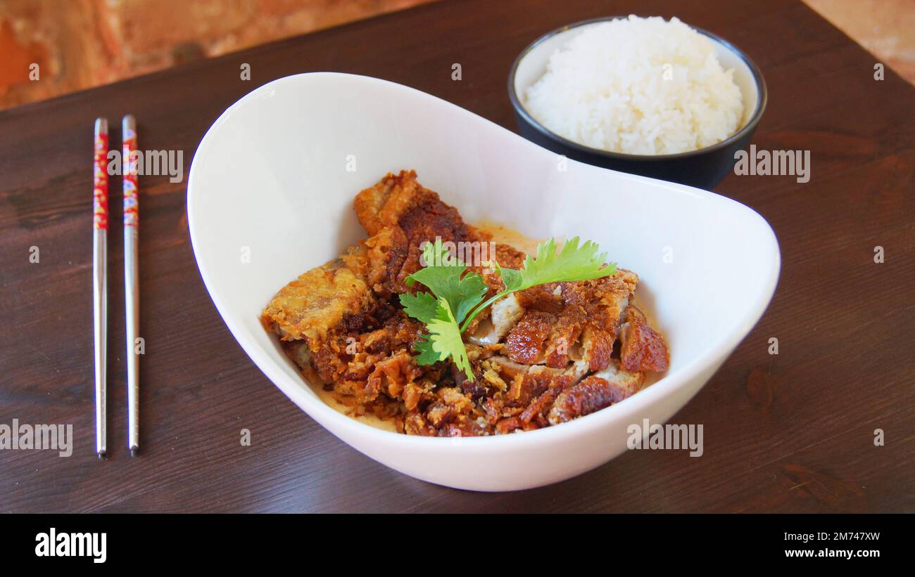 Dish with crispy duck in a restaurant in Tokyo. Asian combo plate with ...