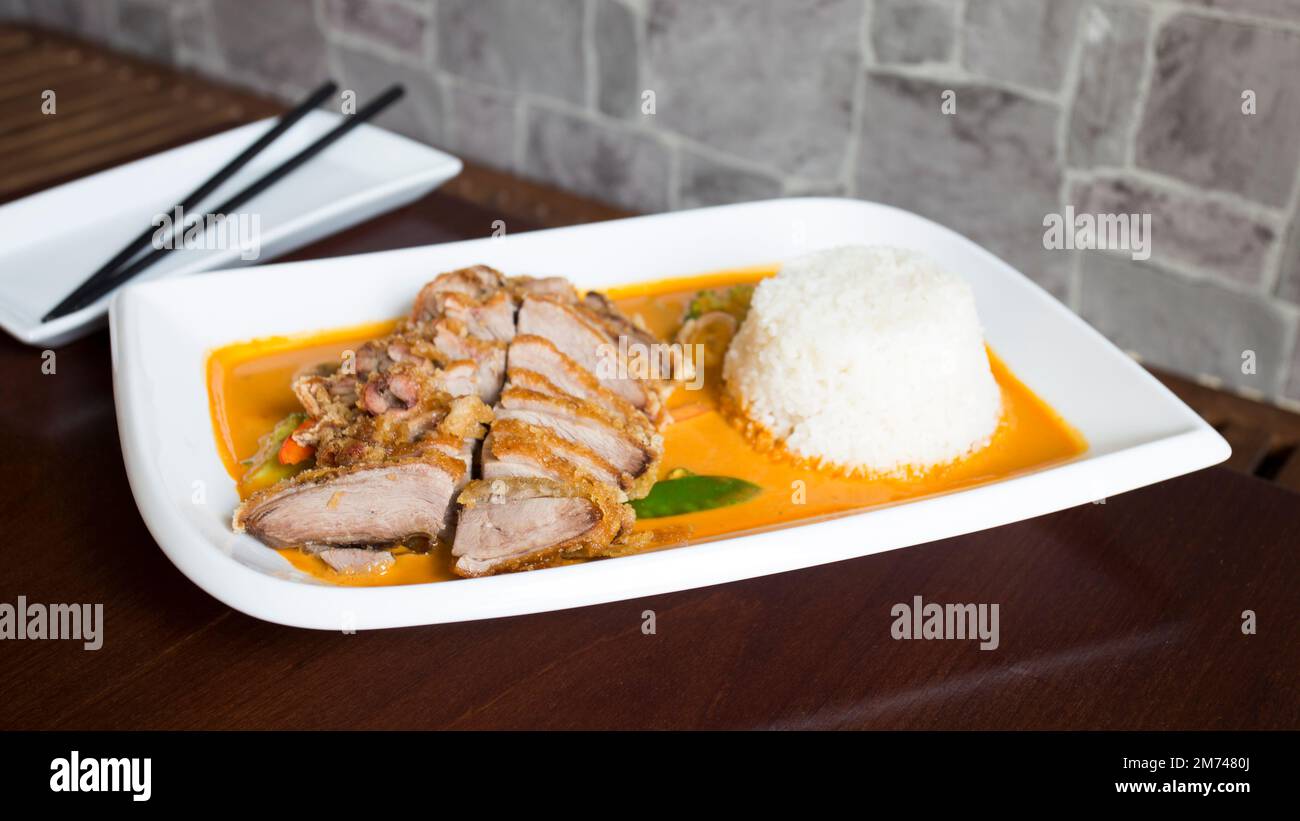 Dish with crispy duck in a restaurant in Tokyo. Asian combo plate with ...