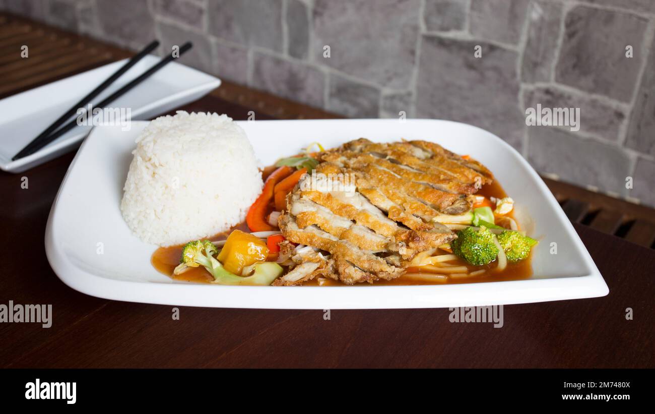 Dish with crispy duck in a restaurant in Tokyo. Asian combo plate with ...