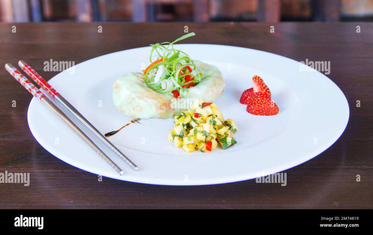 Asian combo plate with fish served with rice or noddles. Dish with ...