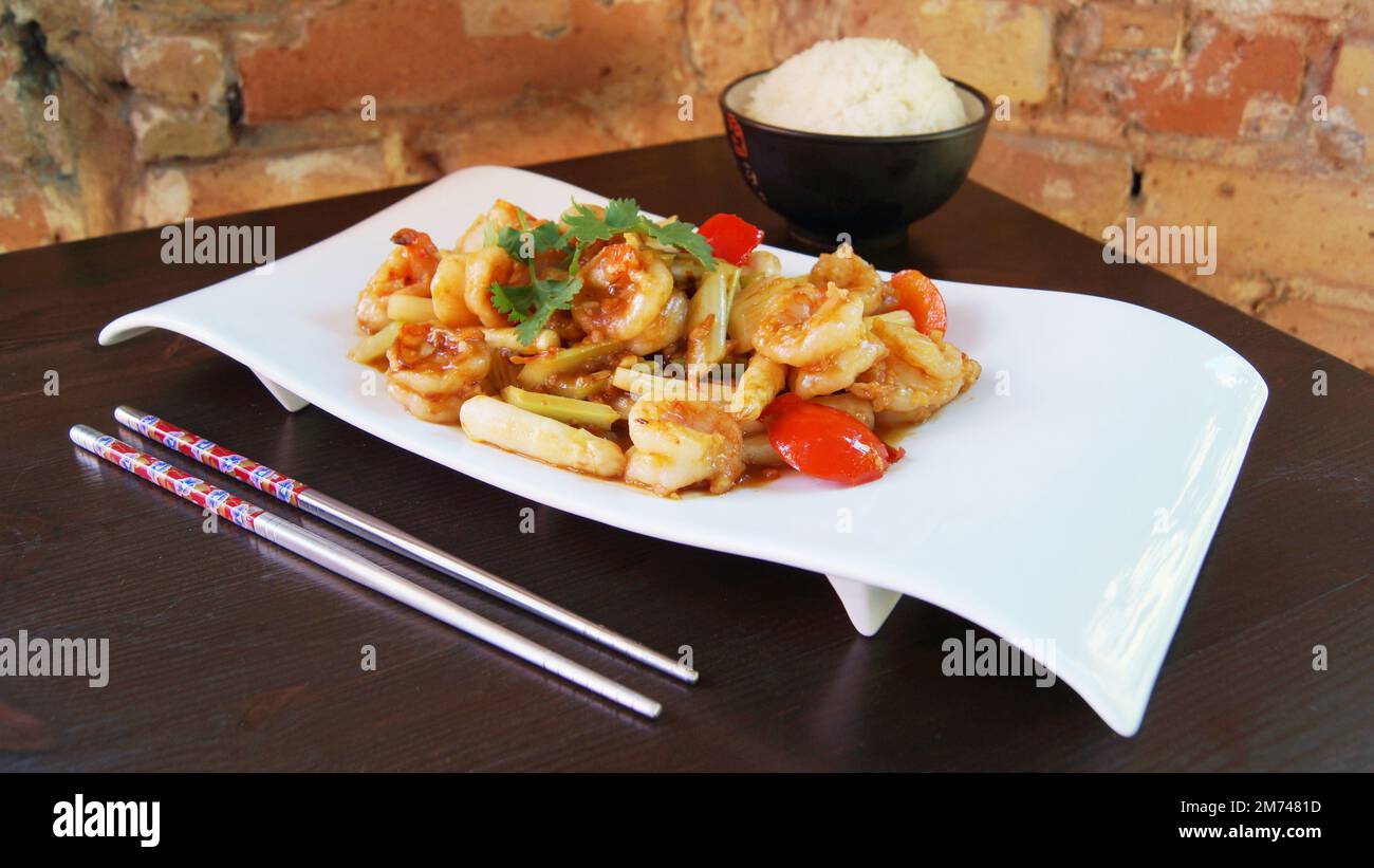 Asian combo plate with fish served with rice or noddles. Dish with ...