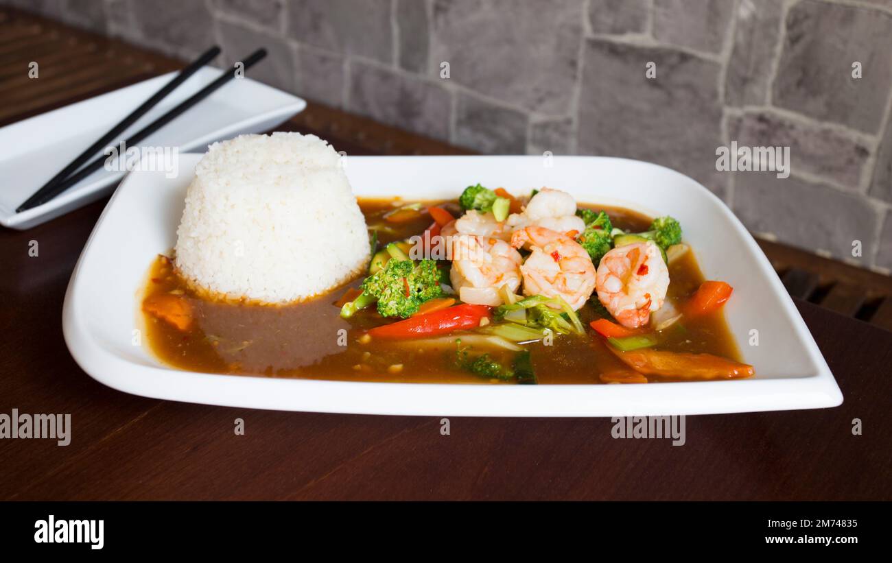 Asian combo plate with fish served with rice or noddles. Dish with ...