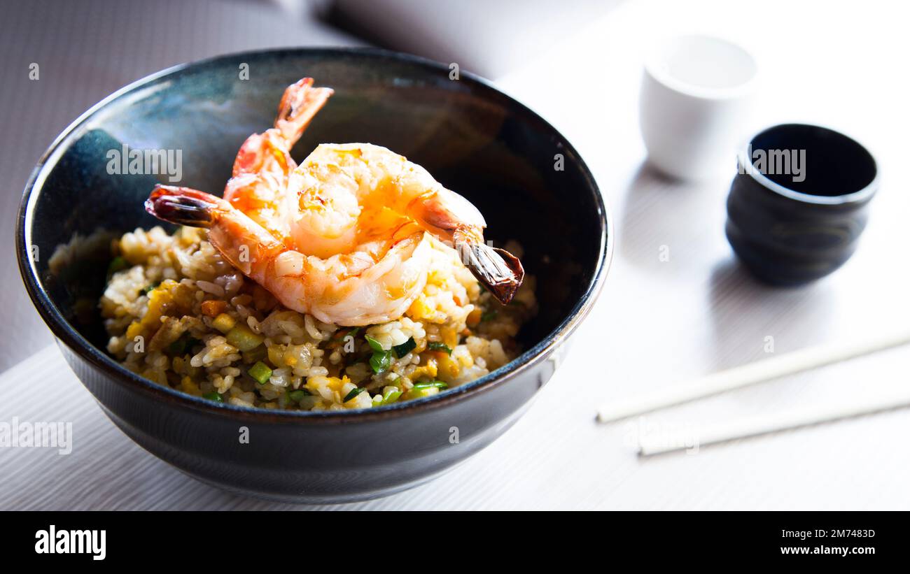 Asian combo plate with fish served with rice or noddles. Dish with ...