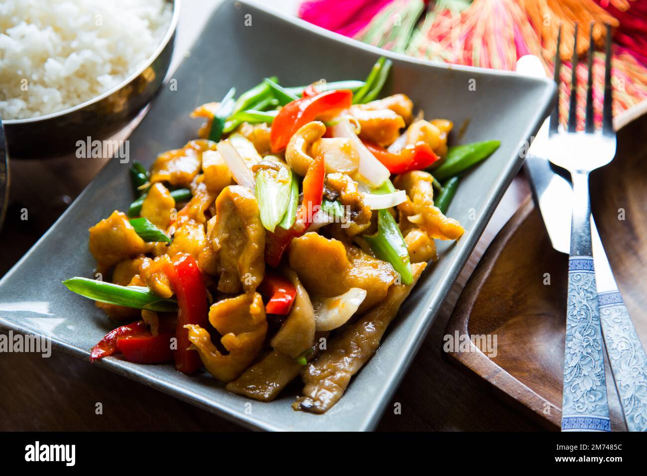 Asian combo plate with chicken cooked with vegetables Stock Photo - Alamy