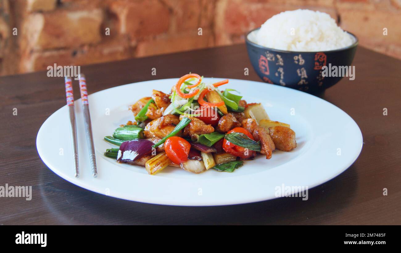 Asian combo plate with chicken cooked with vegetables Stock Photo - Alamy