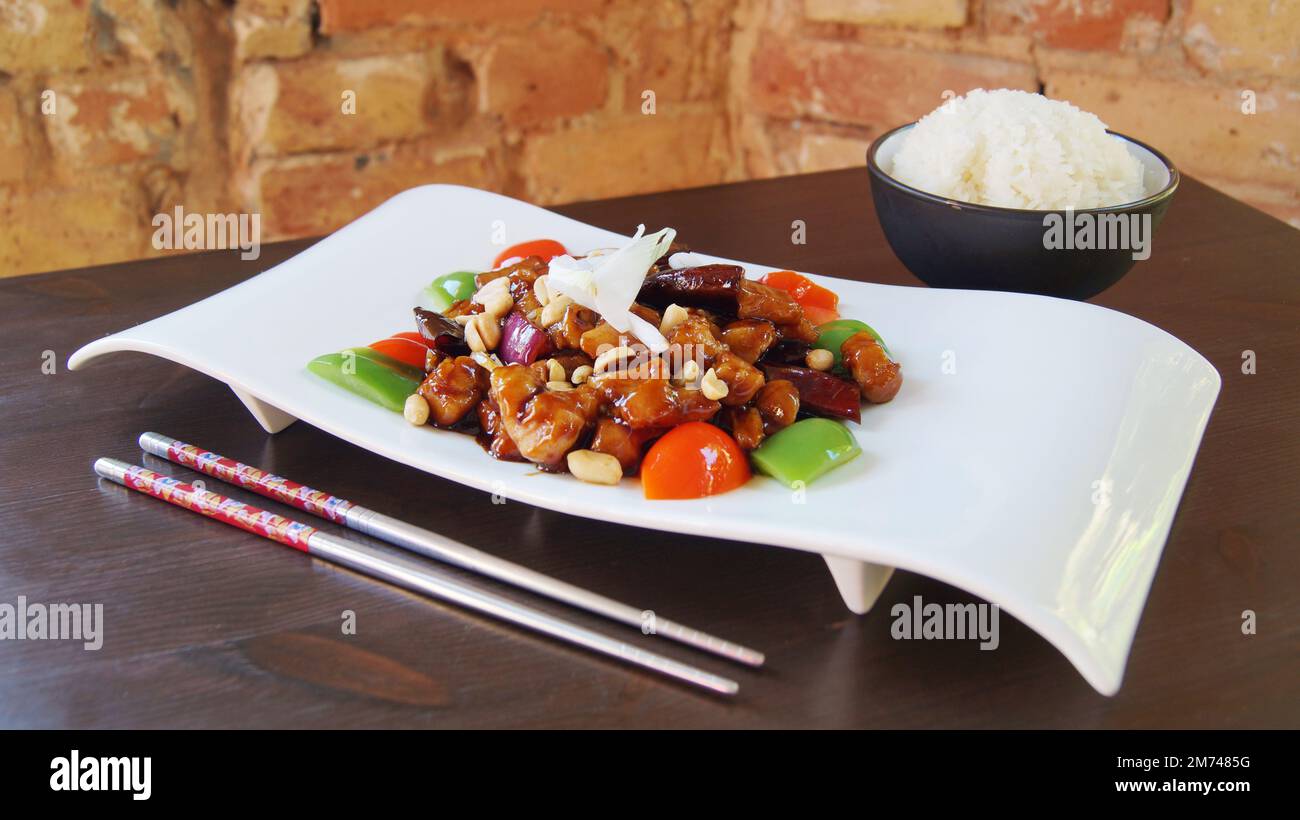 Asian combo plate with chicken cooked with vegetables Stock Photo - Alamy