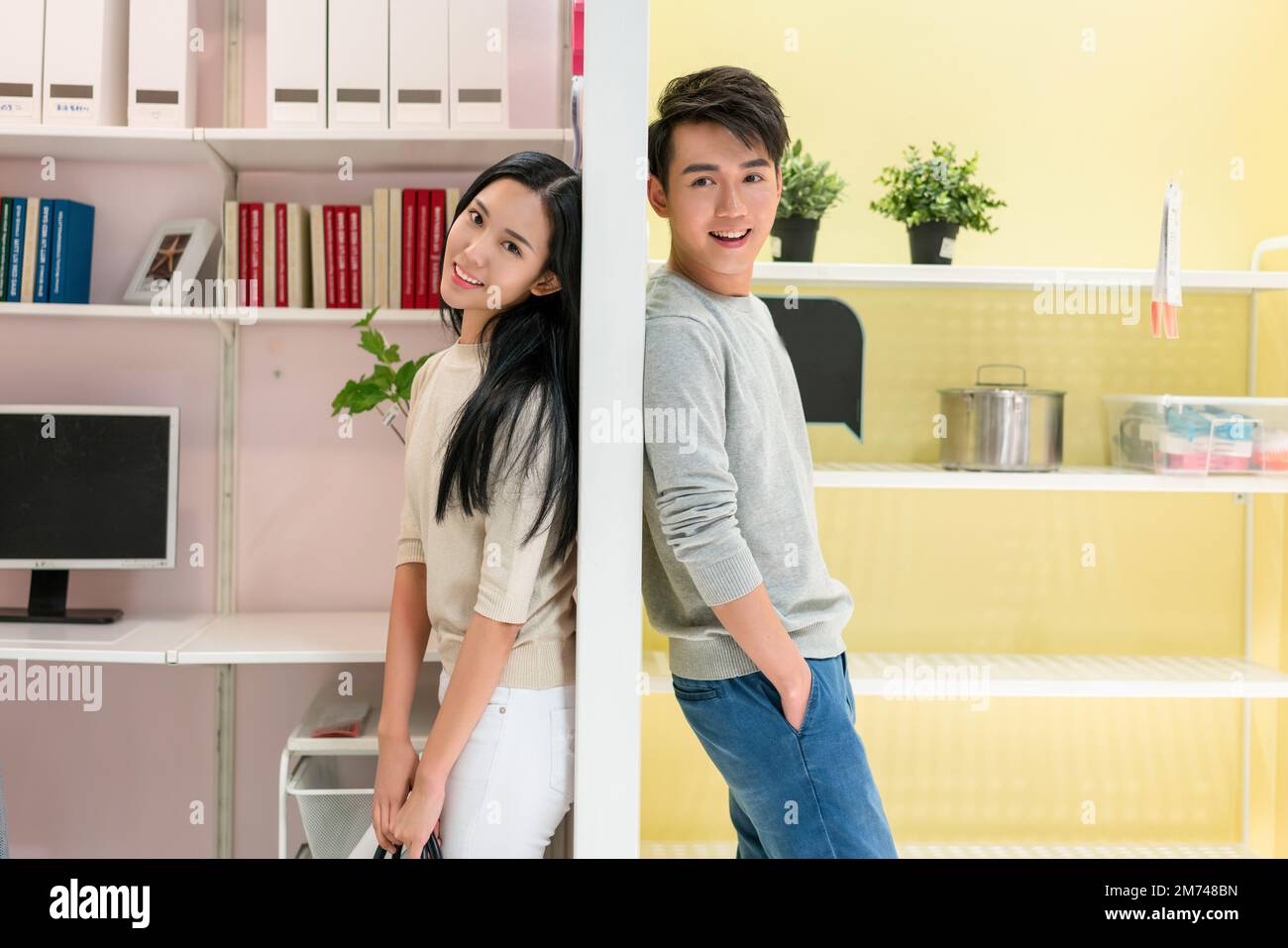 Young lovers back-to-back Stock Photo - Alamy
