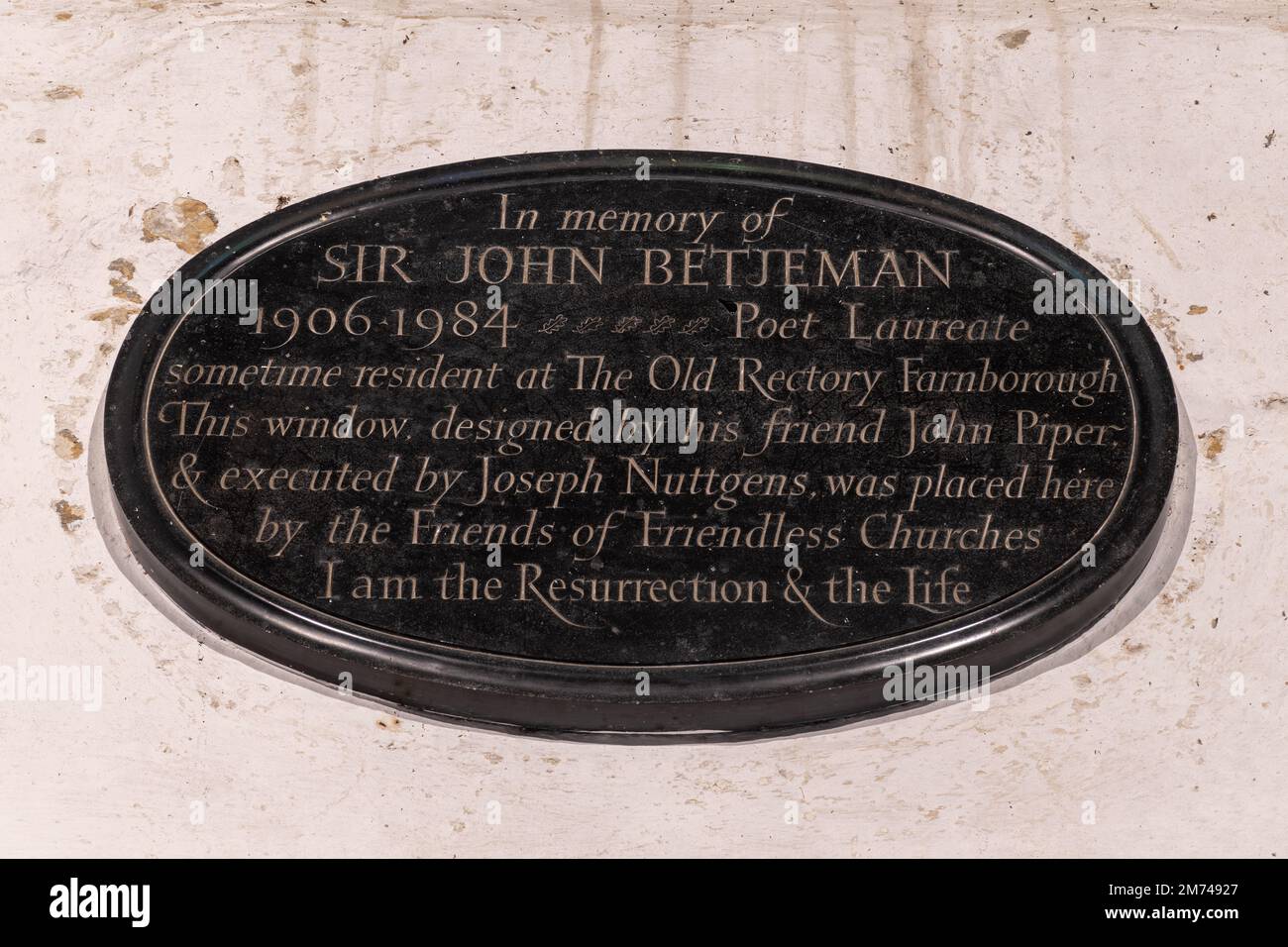 Plaque in memory of Sir John Betjeman below the John Piper stained ...