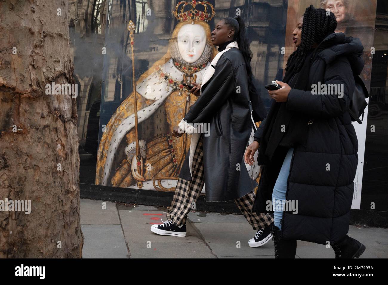 Members of the public walk past reproductions of Queen Elizabeth I ...
