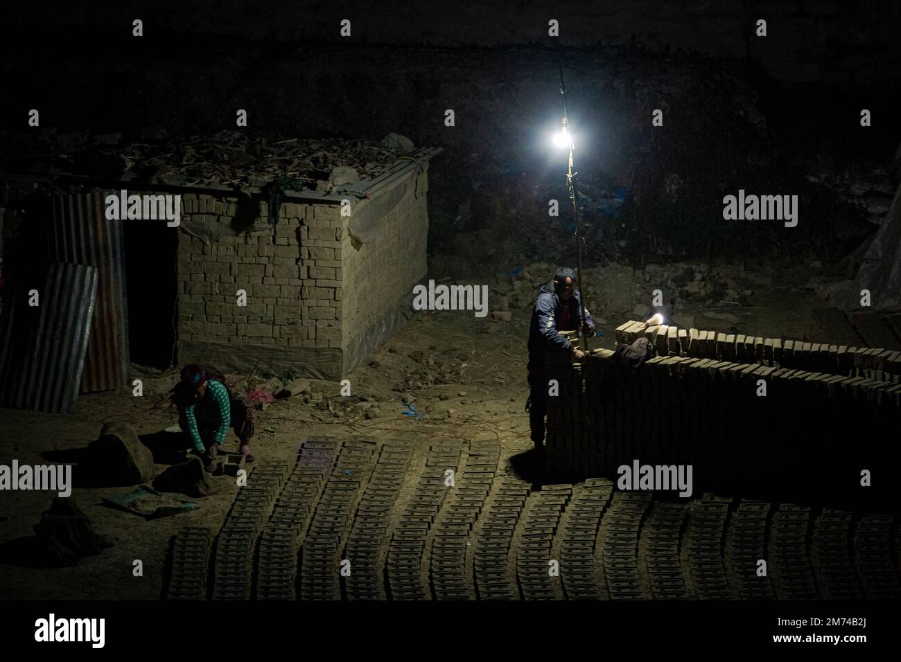 Nepal. 7th Jan, 2023. Labourers work in a brick factory in Sipadol ...