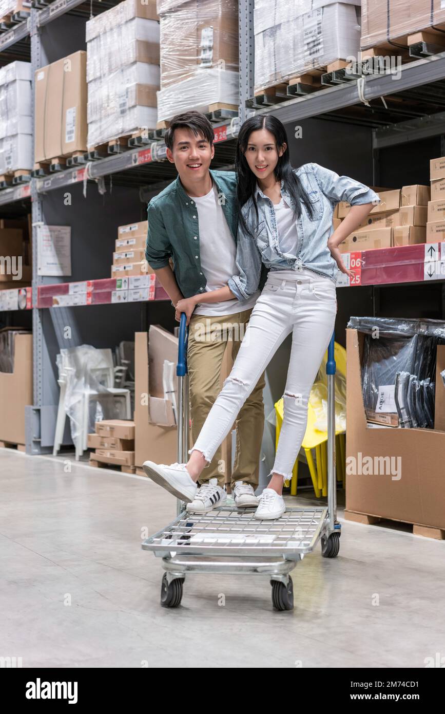 Young lovers furniture of choose and buy building materials Stock Photo ...