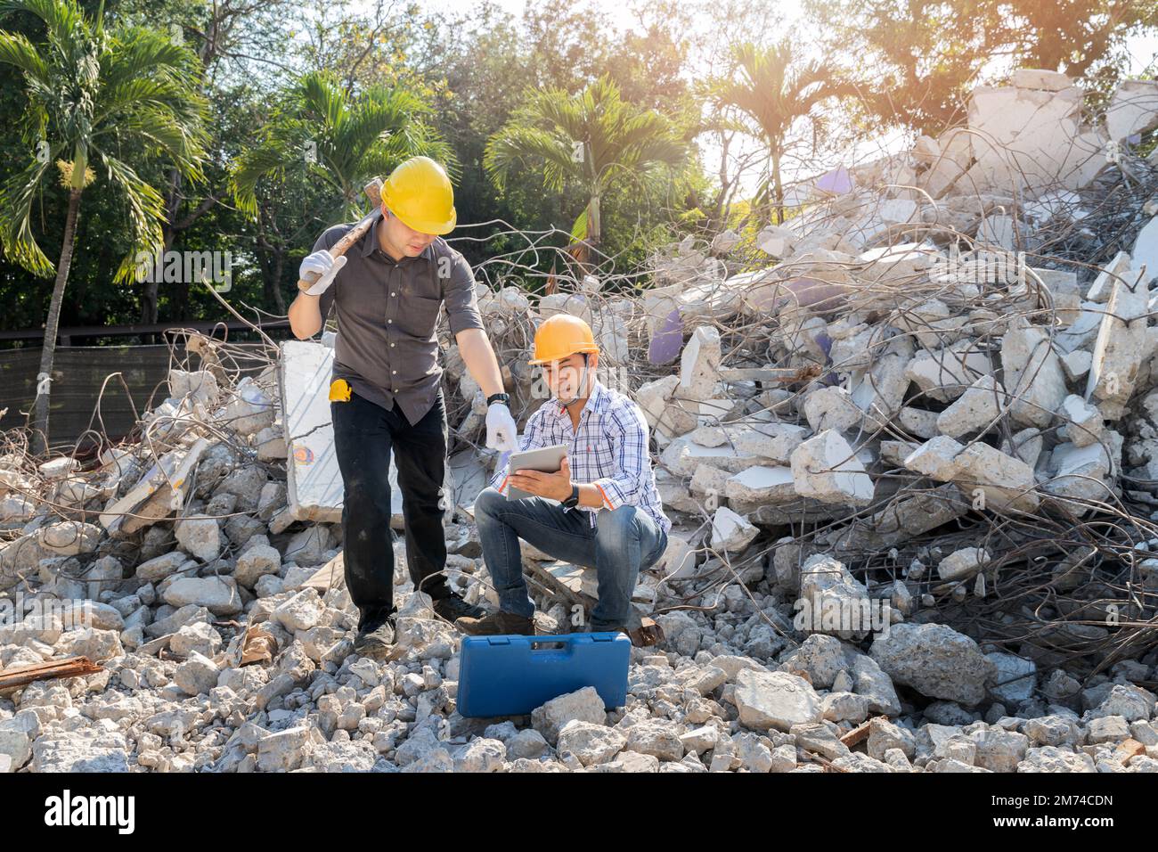 Demolition control supervisor and contractor discussing on demolish ...