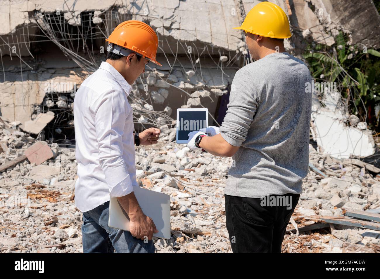 Demolition control supervisor and contractor discussing on demolish ...