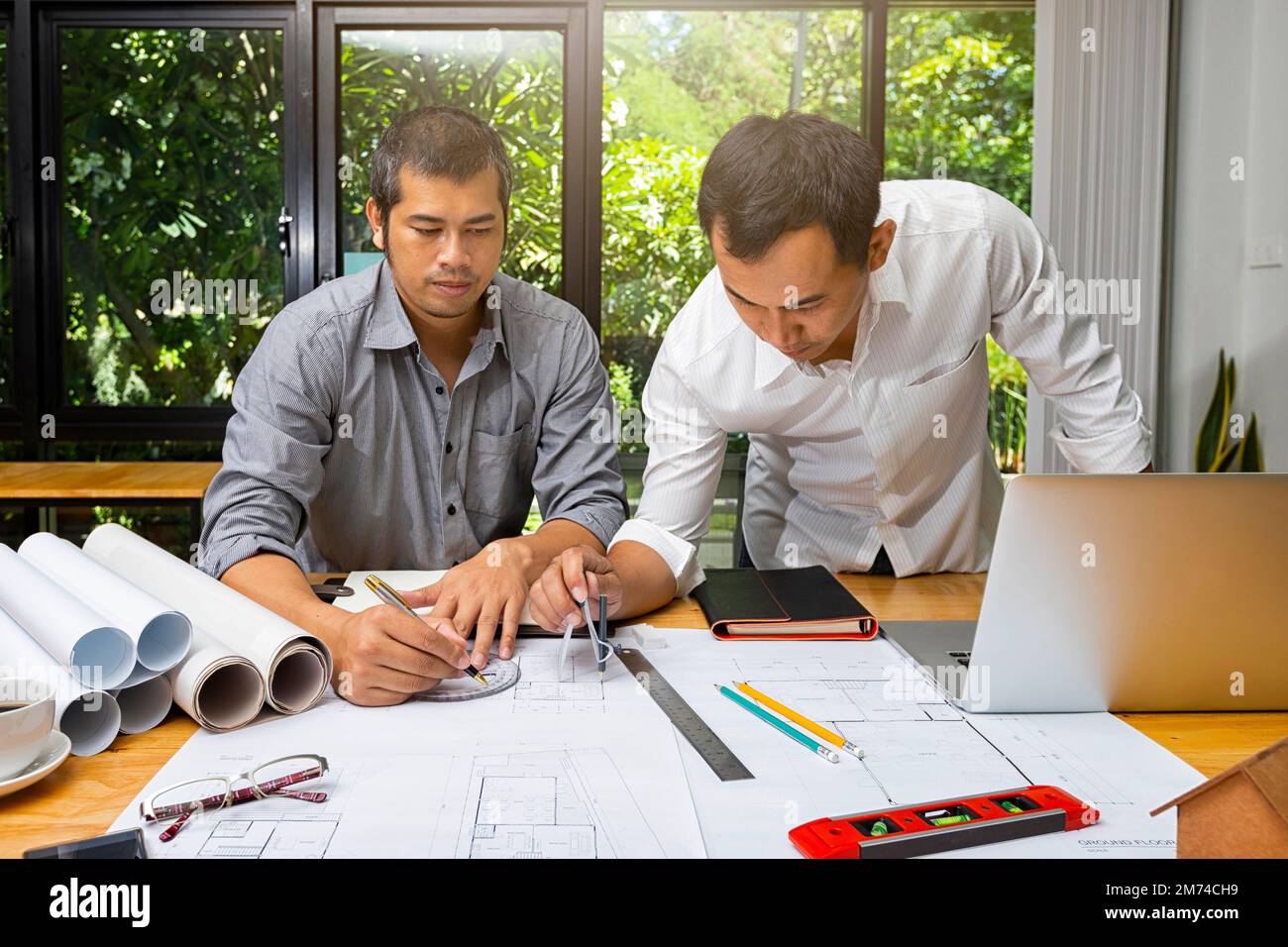 Confident team of architect working together in a office.They ...