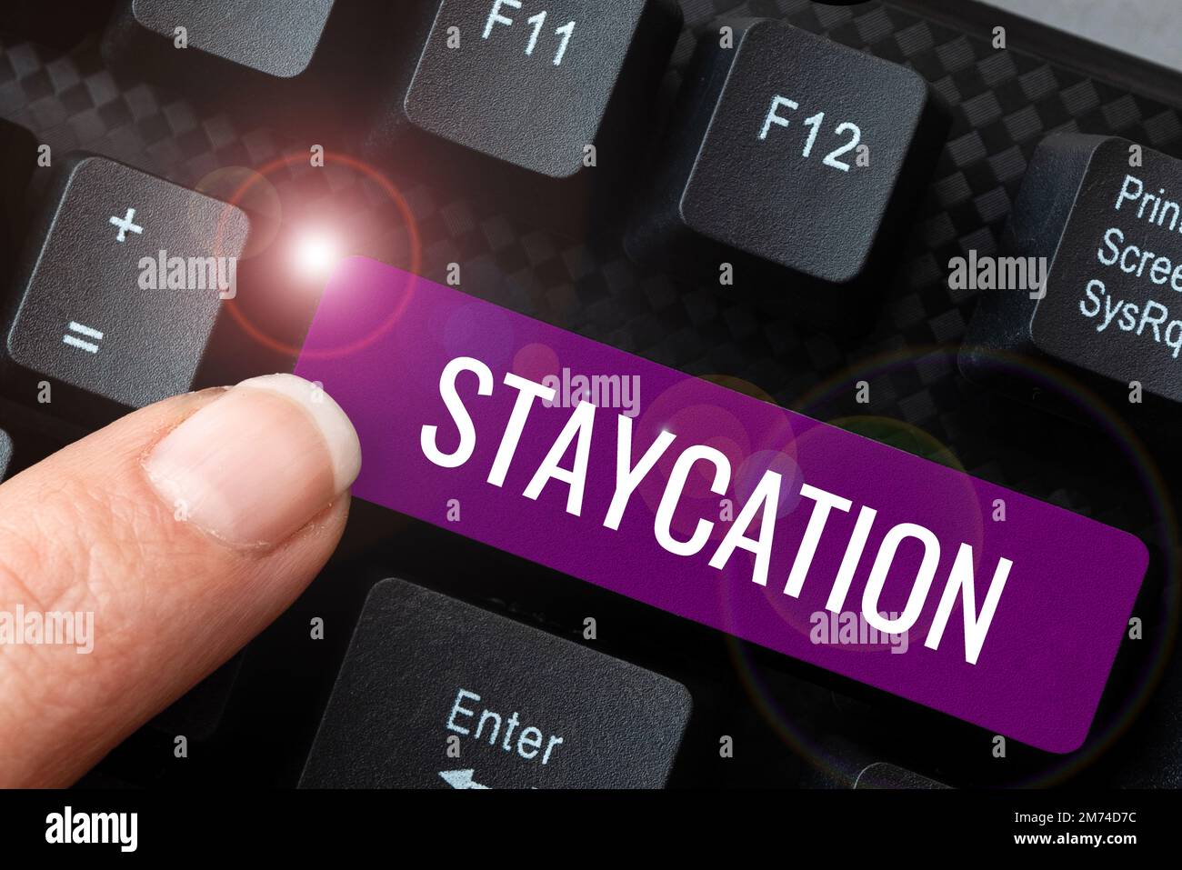 Sign displaying Staycation. Concept meaning a vacation spent at one's ...