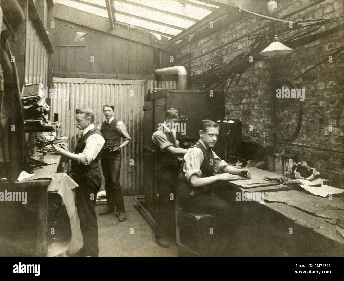England. Circa. 1915. An interesting photograph of a group of craftsmen ...